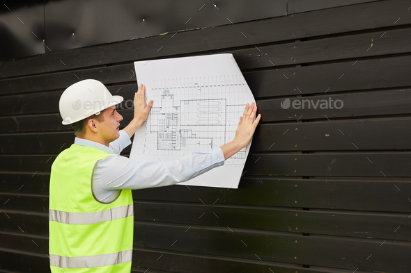 Engineer working with blueprint Stock Photo by AnnaStills | PhotoDune