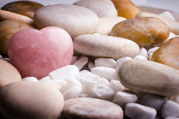 Pink heart stone on the spa stone background. Stock Photo by GitaKulinica