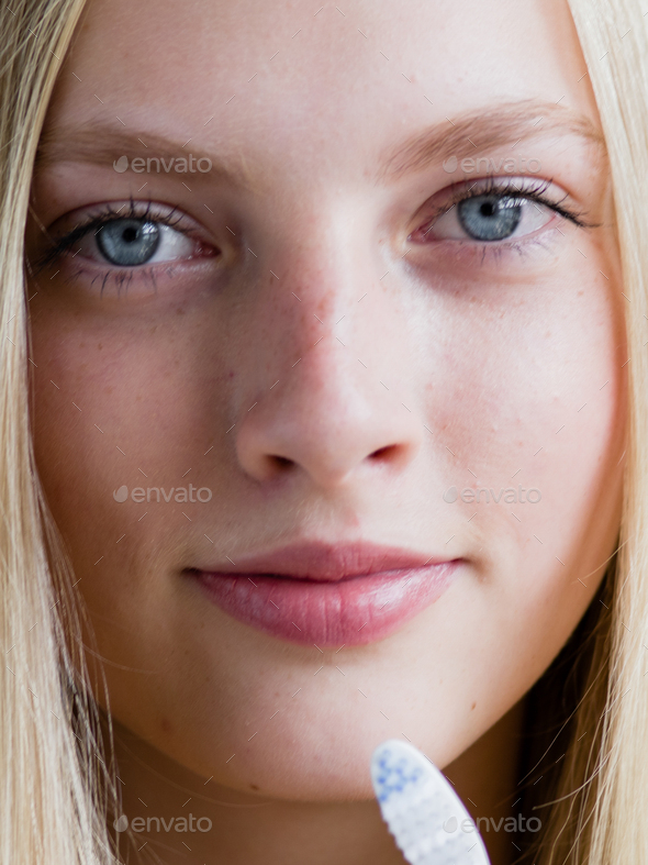 Toothbrush woman blonde long hair girl tetth care Stock Photo by kiraliffe