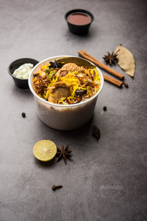 Online Food Delivery - Chicken Biryani packed in Plastic box Stock ...