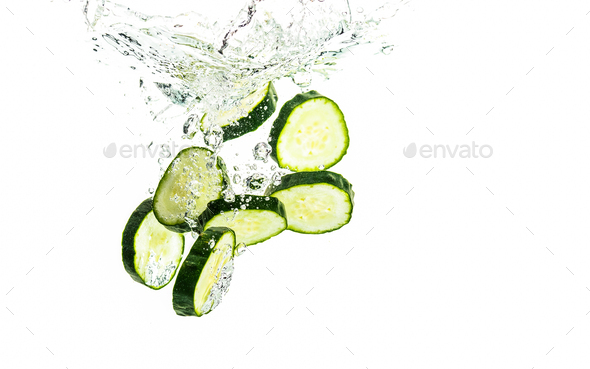 Sliced cucumber splashing water isolated on white background. Stock ...
