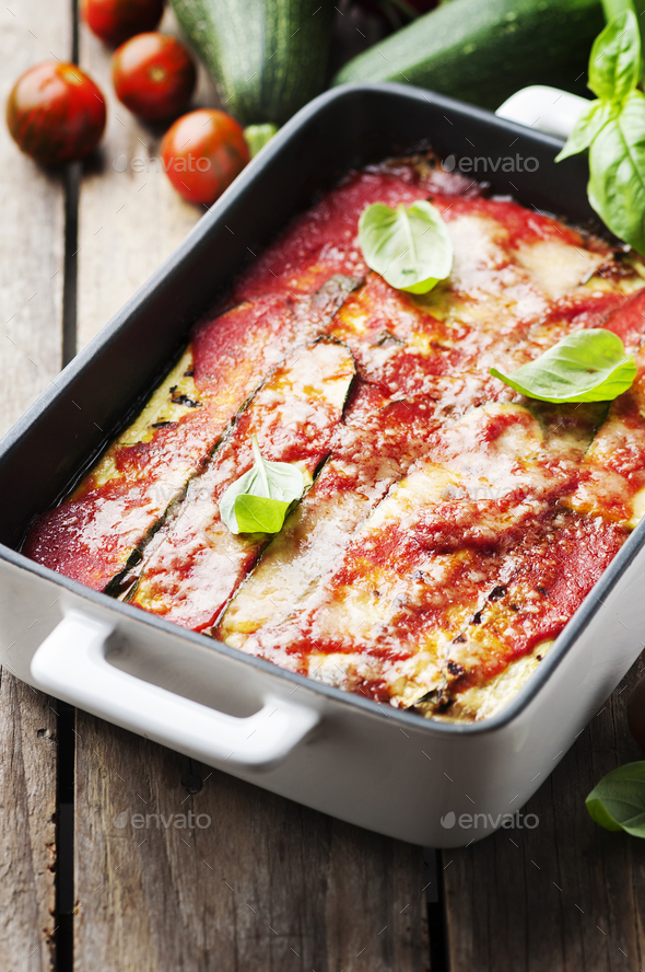 Italian traditional parmigiana with zucchini Stock Photo by OxanaDenezhkina