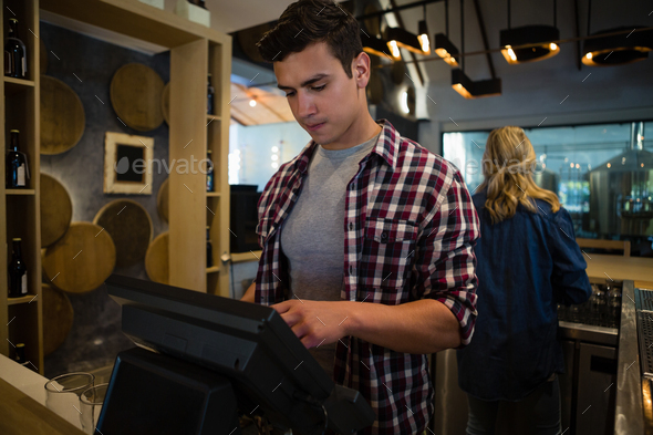 Man using cash register at bar Stock Photo by Wavebreakmedia | PhotoDune