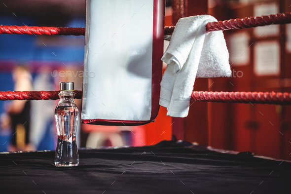Water bottle and a towel in boxing ring Stock Photo by Wavebreakmedia