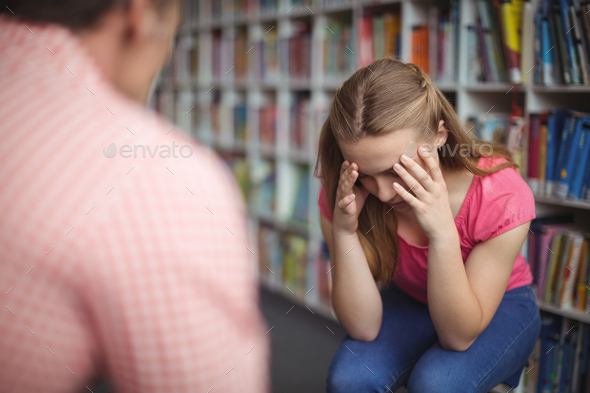 Teacher scolding student in library Stock Photo by Wavebreakmedia ...