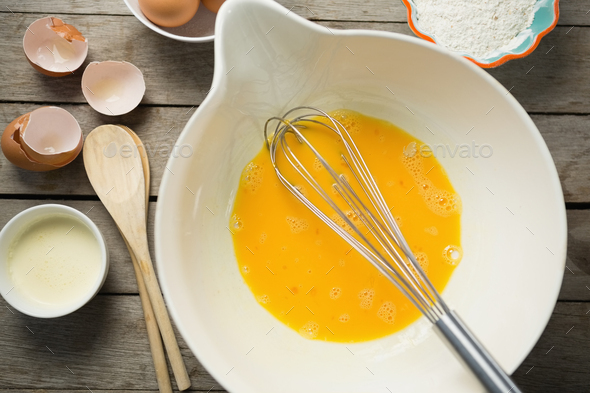 Overhead view of egg yolk in container Stock Photo by Wavebreakmedia