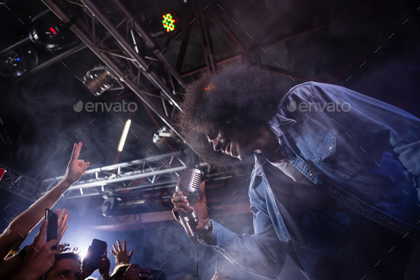 Singer performing on stage Stock Photo by Wavebreakmedia | PhotoDune