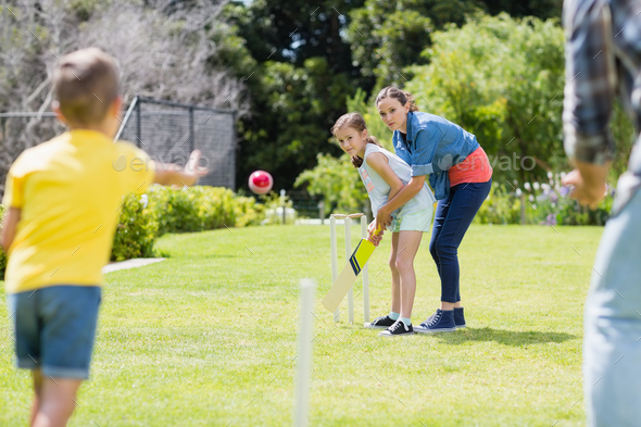 Family playing cricket in park Stock Photo by Wavebreakmedia | PhotoDune