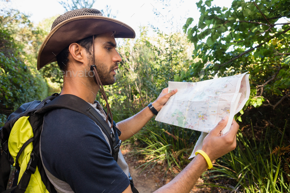 Man reading the map in the forest Stock Photo by Wavebreakmedia | PhotoDune