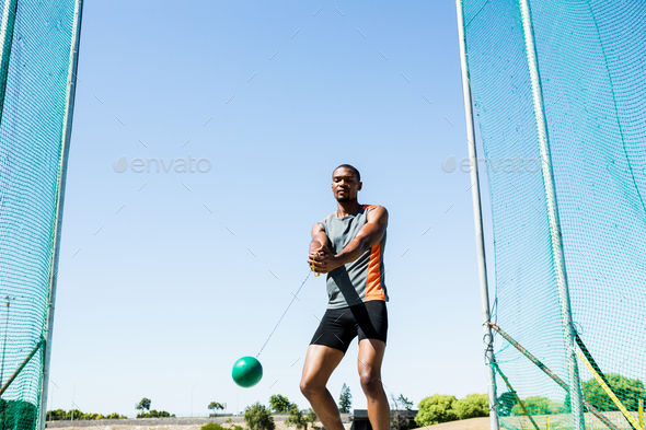 Athlete performing a hammer throw Stock Photo by Wavebreakmedia | PhotoDune