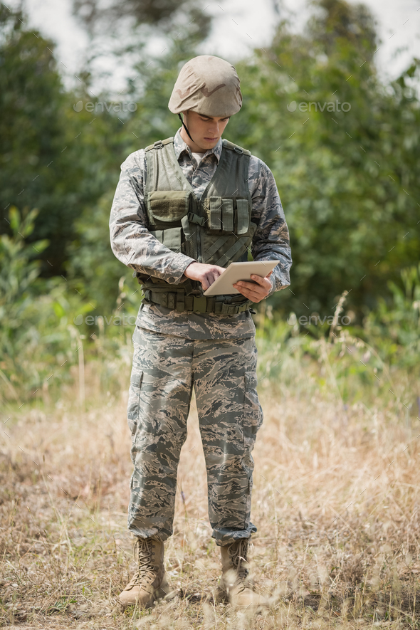 Military soldier using digital tablet Stock Photo by Wavebreakmedia