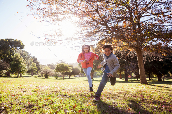 Smiling children running in park Stock Photo by Wavebreakmedia | PhotoDune