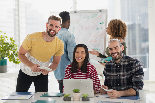 Team of executives working together in the office Stock Photo by ...