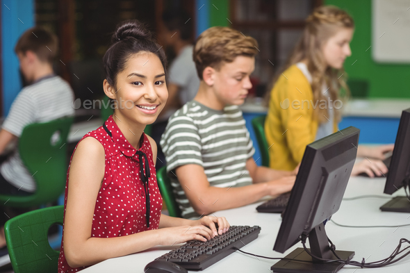 Smiling students studying in computer classroom Stock Photo by ...