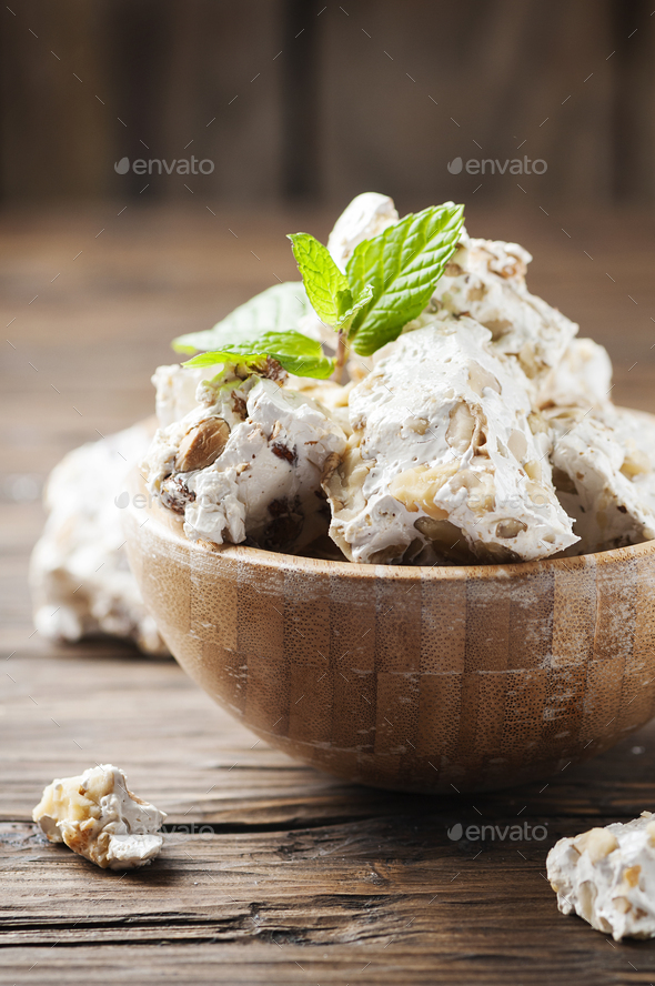 Traditional italian nougat with nuts Stock Photo by OxanaDenezhkina
