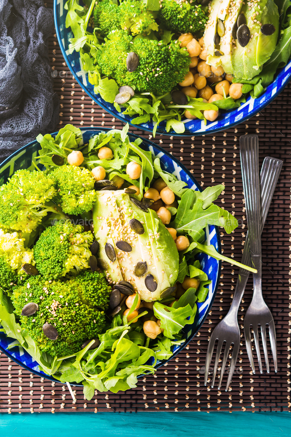 Plant based lunch meal with broccoli and avocado. Stock Photo by tenkende
