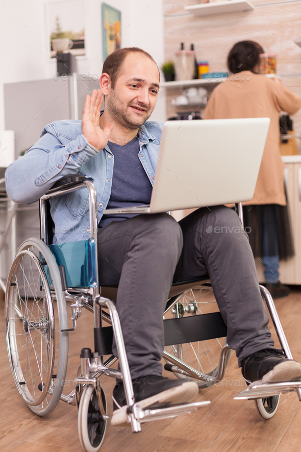 Disabled entrepreneur waving Stock Photo by DC_Studio | PhotoDune