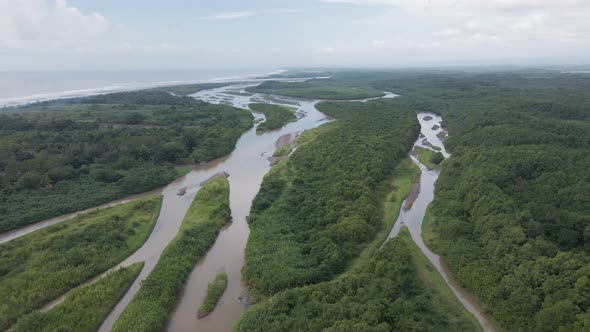 Costa Rica wetlands at the central pacific coast underneath a blue and ...