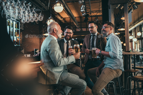 Teamwork at the pub Stock Photo by bernardbodo | PhotoDune