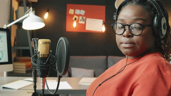 Portrait of African American Female Podcaster in Home Studio, Stock Footage