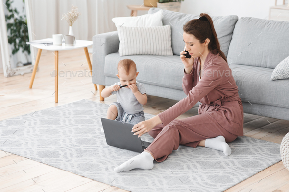 Motherhood And Multitasking. Mom Working At Home While Baby Distructing ...