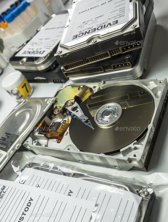 Hard drives in crime lab, concept image Stock Photo by felipecaparros