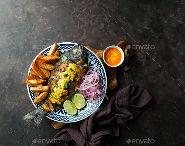 Chita frita al ajo, al ajillo, Peruvian food, a whole fish, served wit ...