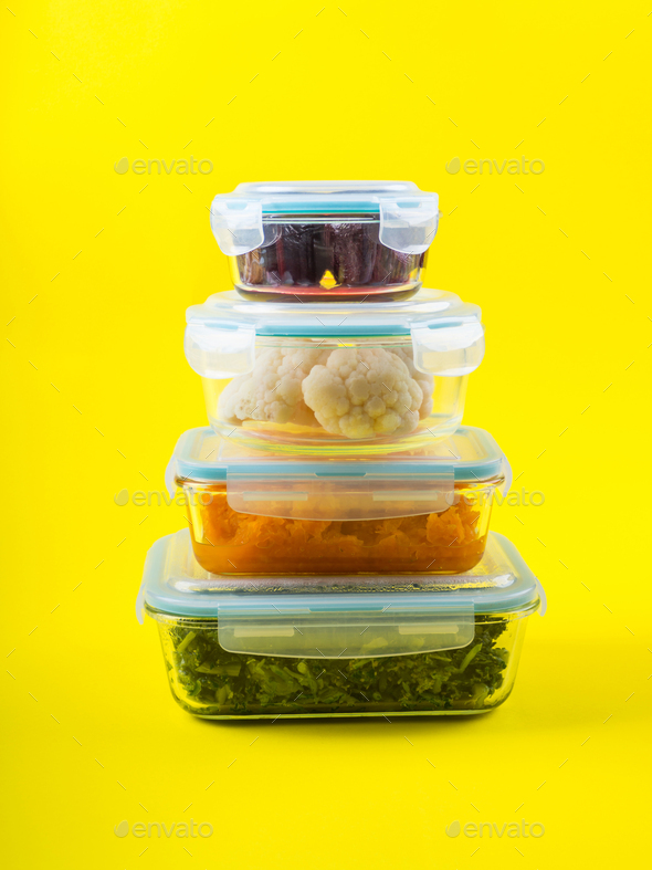 Stack of airtight glass containers with cooked food Stock Photo by tenkende