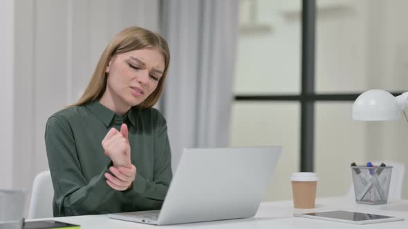Young Woman Having Wrist Pain While Typing on Laptop, Stock Footage