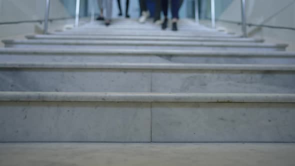 Closeup Stairs in Office with Feet of People Rushing Walking Downstairs ...