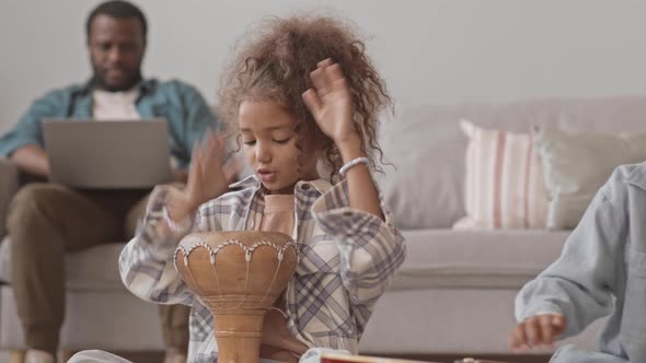 Two Little Sisters Playing Musical Instruments at Home, Stock Footage