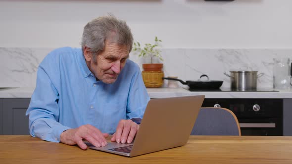 Handsome Elderly Senior Man Working on Laptop Computer at Home, Stock ...