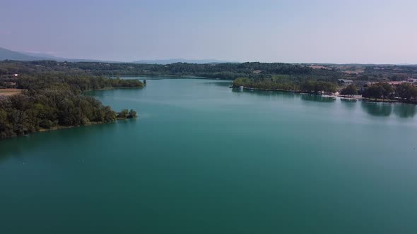Aerial view over a beautiful landscape with a magnificent natural lake ...
