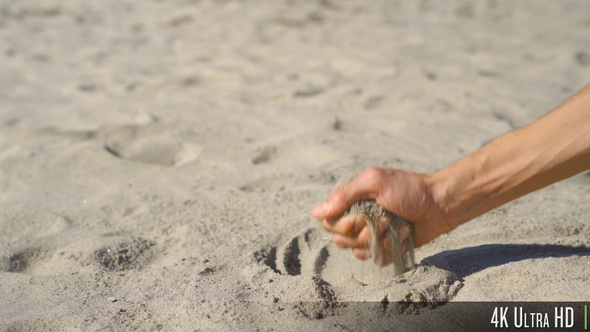 4K Gently picking up a handful of sand and pouring out close-up, Stock ...