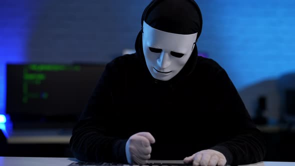 Nervous Stressed Unrecognizable Hacker in Black Clothes and Anonymous ...