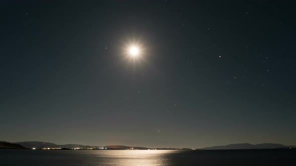 Moonlight Path with Fool Moon Above Calm Sea Surface, Stock Footage
