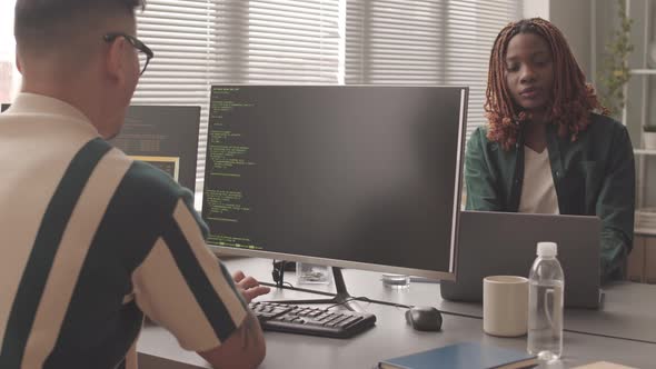 Diverse Programmers Typing Program Codes on Computer in Office, Stock Footage