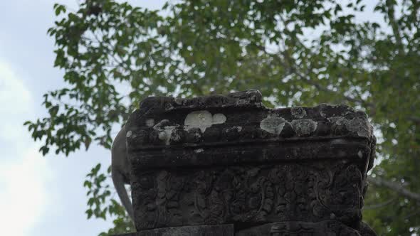 Medium Shot of a Monkey on an Ancient Stone Pillar at Angkor Wat, Stock ...