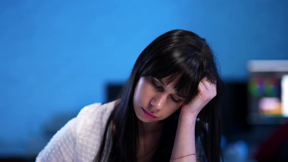 Closeup of Tired Caucasian Woman Falling Asleep in Blue Room with ...