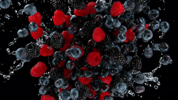 Super Slow Motion Shot of Rotating Exploded Berries Fruit with ...
