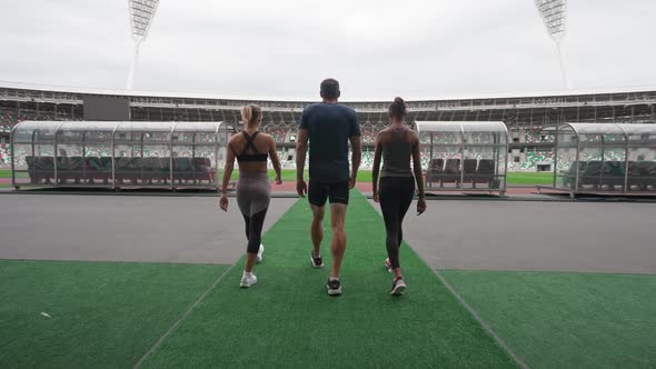 Professional Athletes Sprinters Go to the Olympic Stadium Back View ...