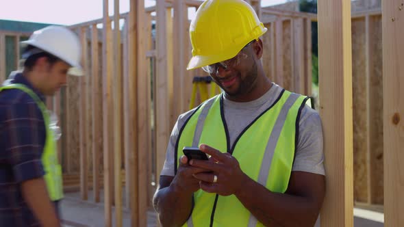 Construction worker texting on cell phone, Stock Footage | VideoHive