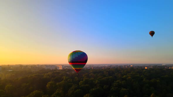 Aerial Drone HDR View of Colorful Hot Air Balloon Flying Over Green ...
