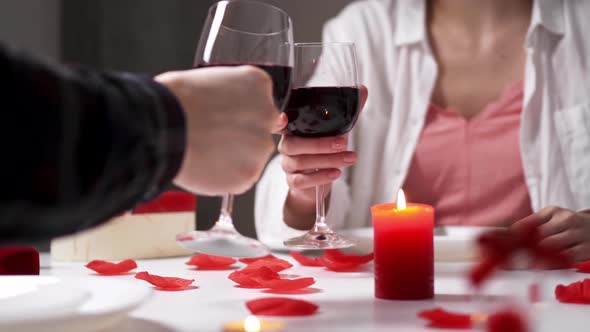 Red Wine Hit The Knock Of Wine Glasses. A Couple In Love Drinks Wine At ...