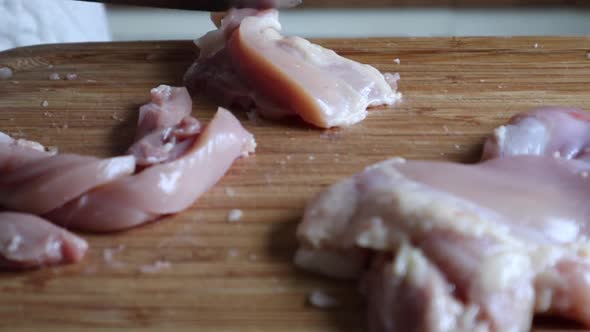 Chicken Breast Meat Cut Into Strips In Wooden Chopping Board. - Close ...