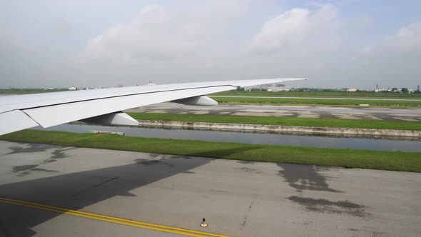 Close-up Airplane Wing Over the Runway, the Plane Is Ready for Takeoff ...