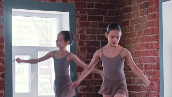 Two Ballerina Girls Performing Basic Dancing Moves in the Studio, Stock ...