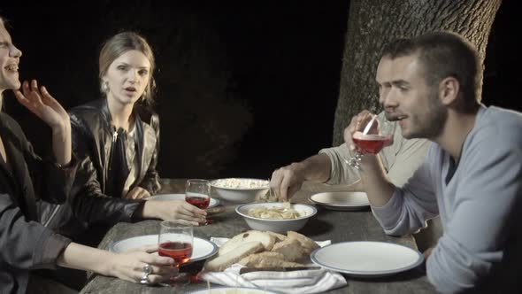 Group of Four Happy Men and Women Friends Smile and Enjoy Aperitif in ...