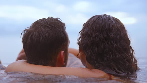 Intimate Shot of a Couple Cuddling While Bathing in an Infinity Pool ...