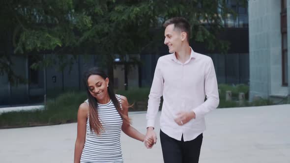 Two Mixed-race Sweethearts Having Fun Running Together in Park, Stock ...